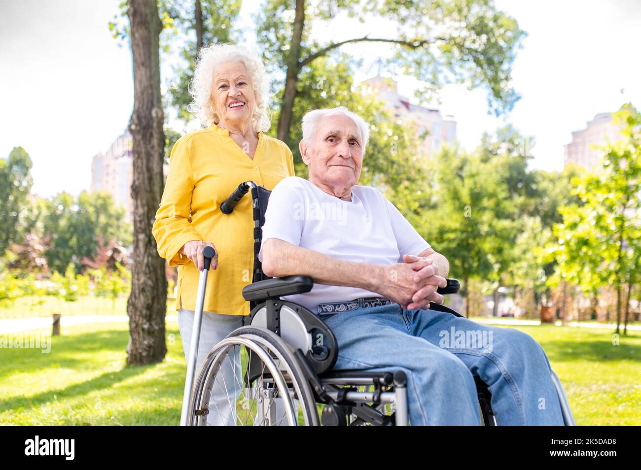 Beautiful senior couple with disability outdoors - Old people in the ...