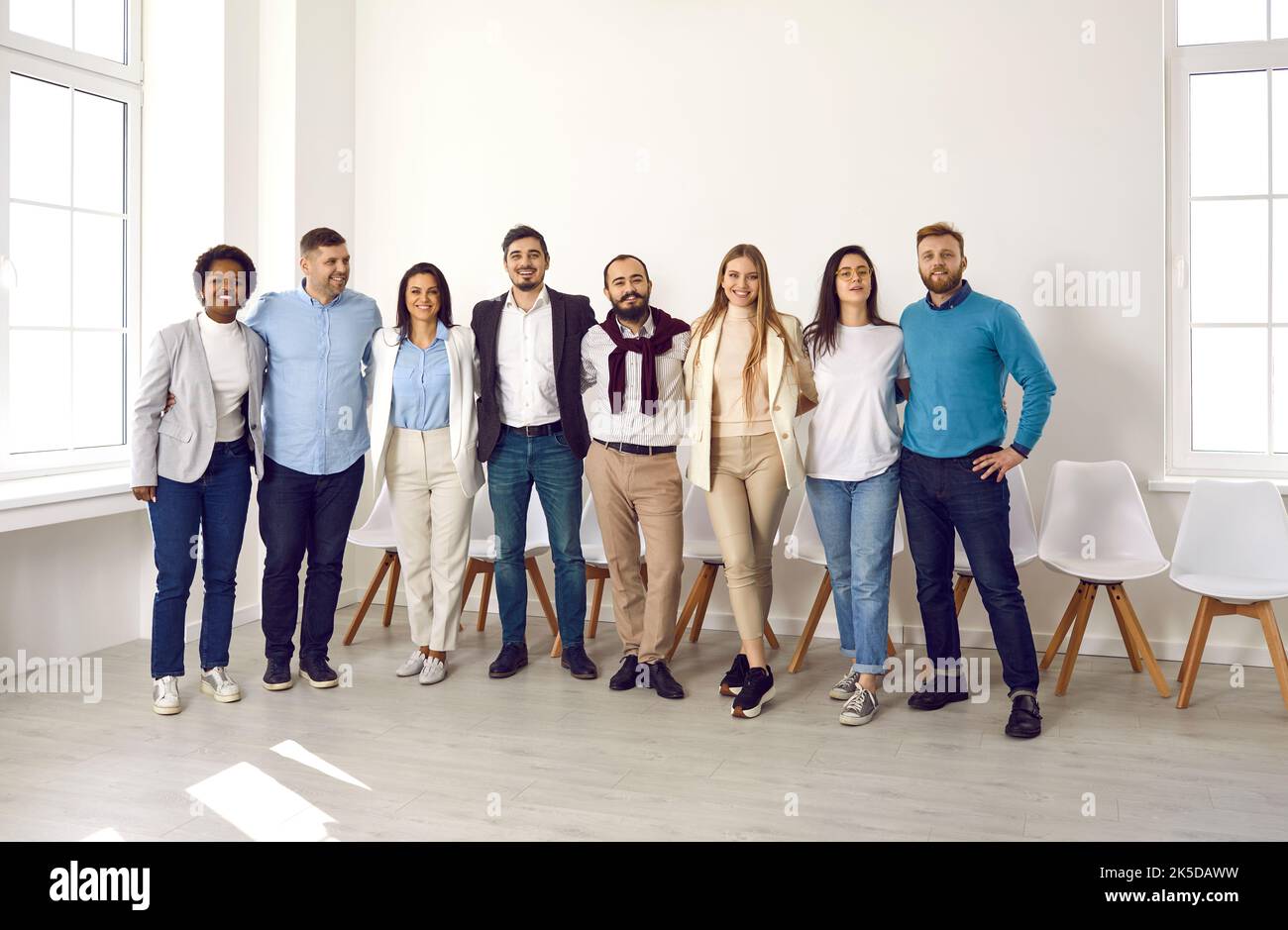 Successful group of business people at the office looking at the camera ...