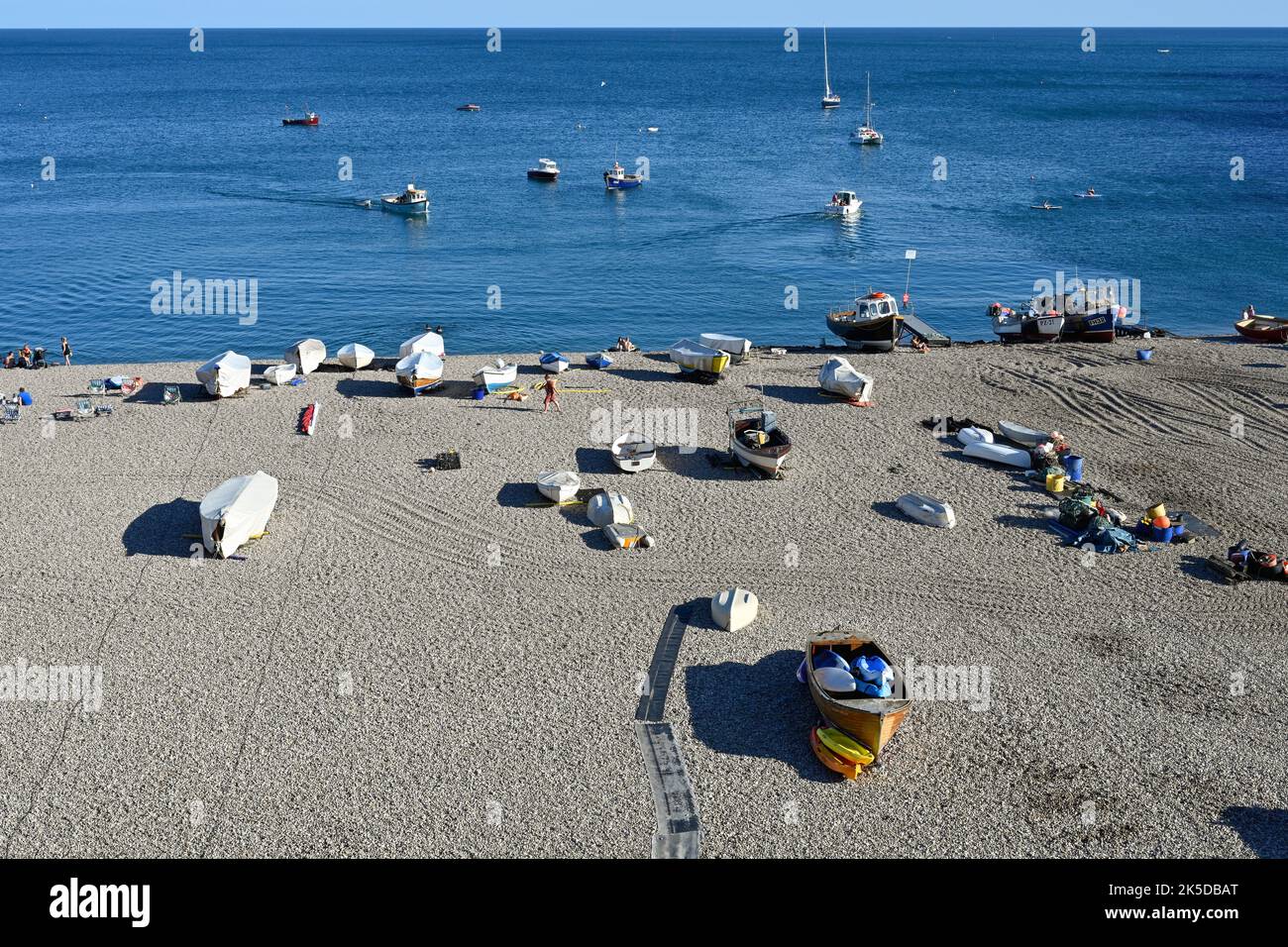 Fishing boats on Beer Beach from the South Coast Path and cliff top ...