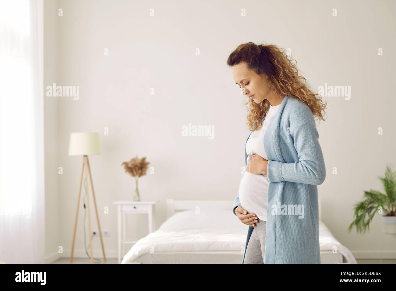 Healthy young woman touch pregnant belly Stock Photo - Alamy Healthy young woman touch pregnant belly Stock Photo - Alamy