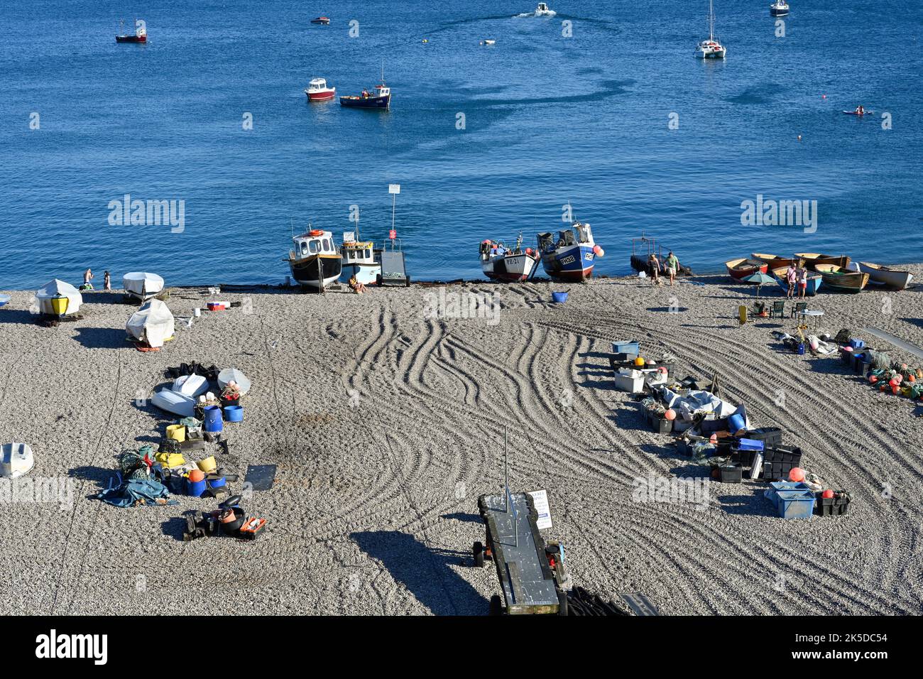 Fishing boats on Beer Beach from the South Coast Path and cliff top ...