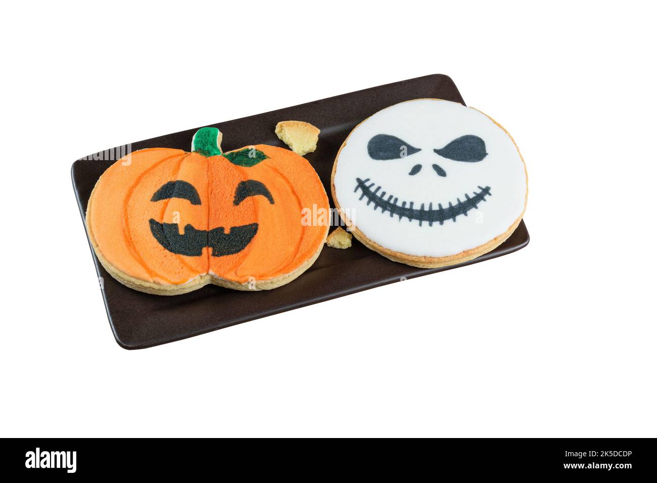 Butter cookies in the shape of a pumpkin and head, on a brown plate ...