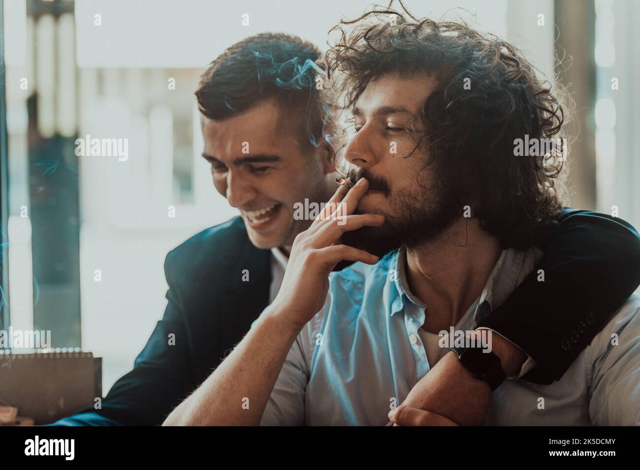 Portrait of multiethnic diverse gay LGBT romantic male couple embracing ...