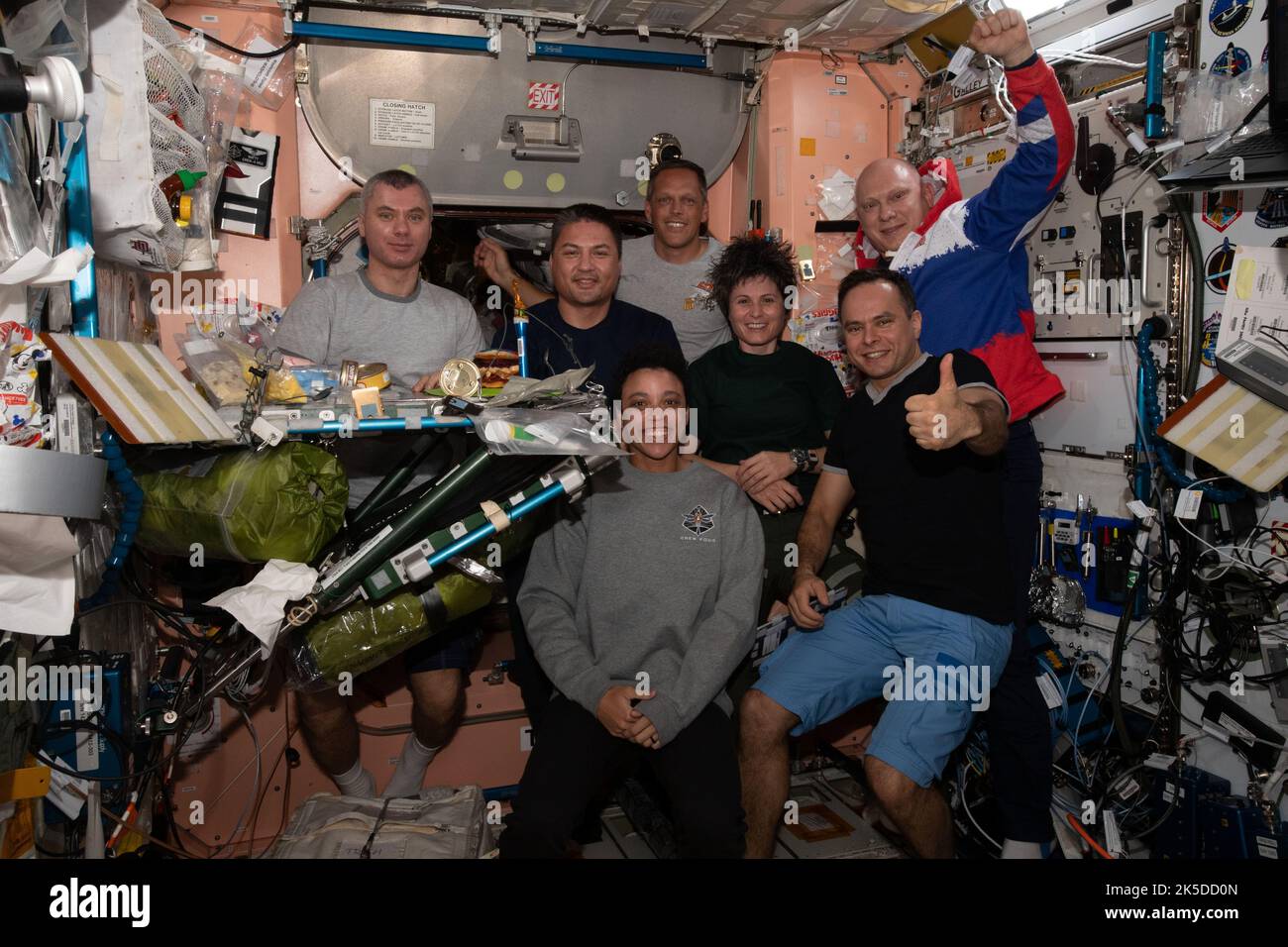 The Expedition 67 crew pose together for a portrait during dinner time ...