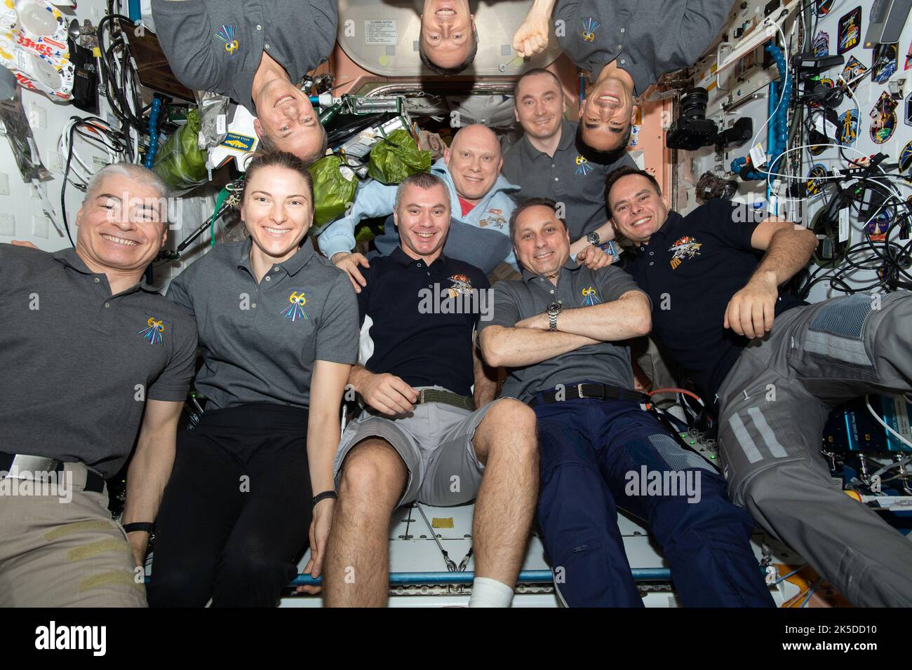 The ten-member Expedition 66 crew poses for a portrait aboared the ...