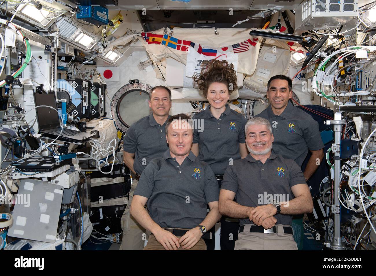 Five Expedition 66 Flight Engineers pose for a portrait inside the ...