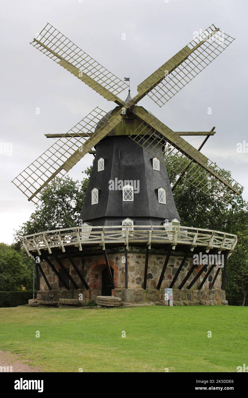 A vertical low-angle closeup of Castle Mill, gloomy sky background, and ...