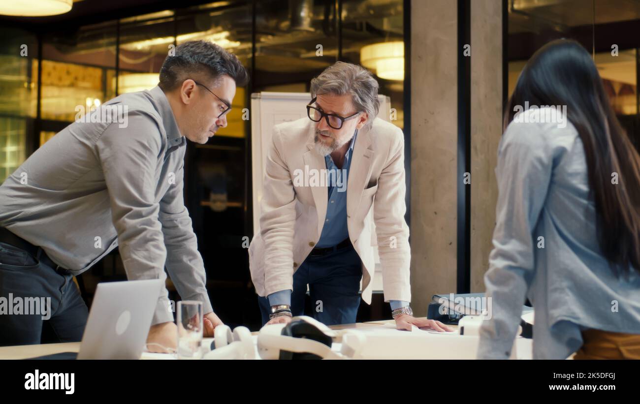 CEO talking, leading business meeting in office conference room ...