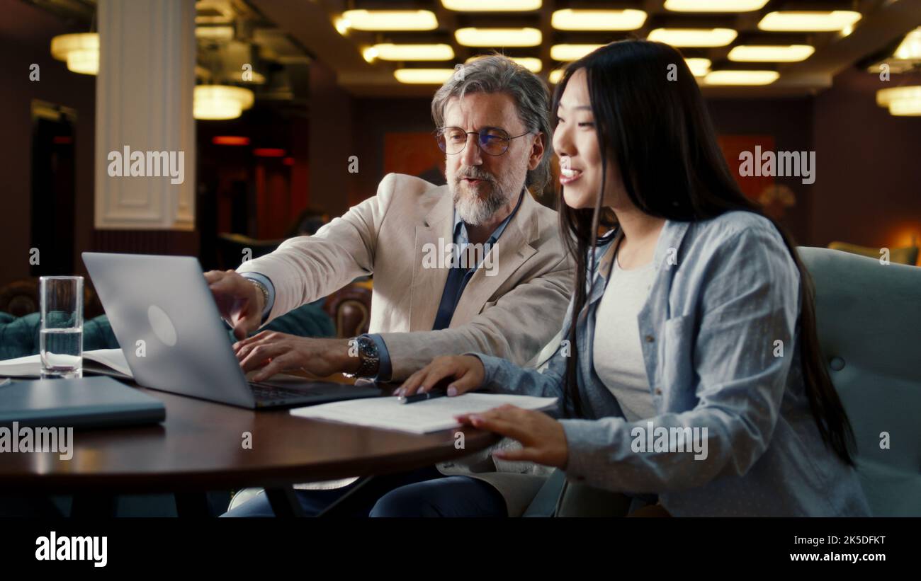 Asian businesswoman making deal, signing contract for successful ...