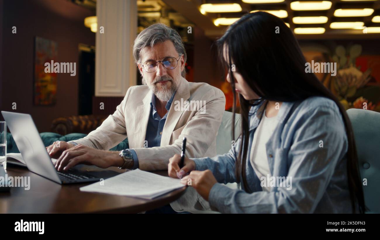 Asian businesswoman making deal, signing contract for successful ...