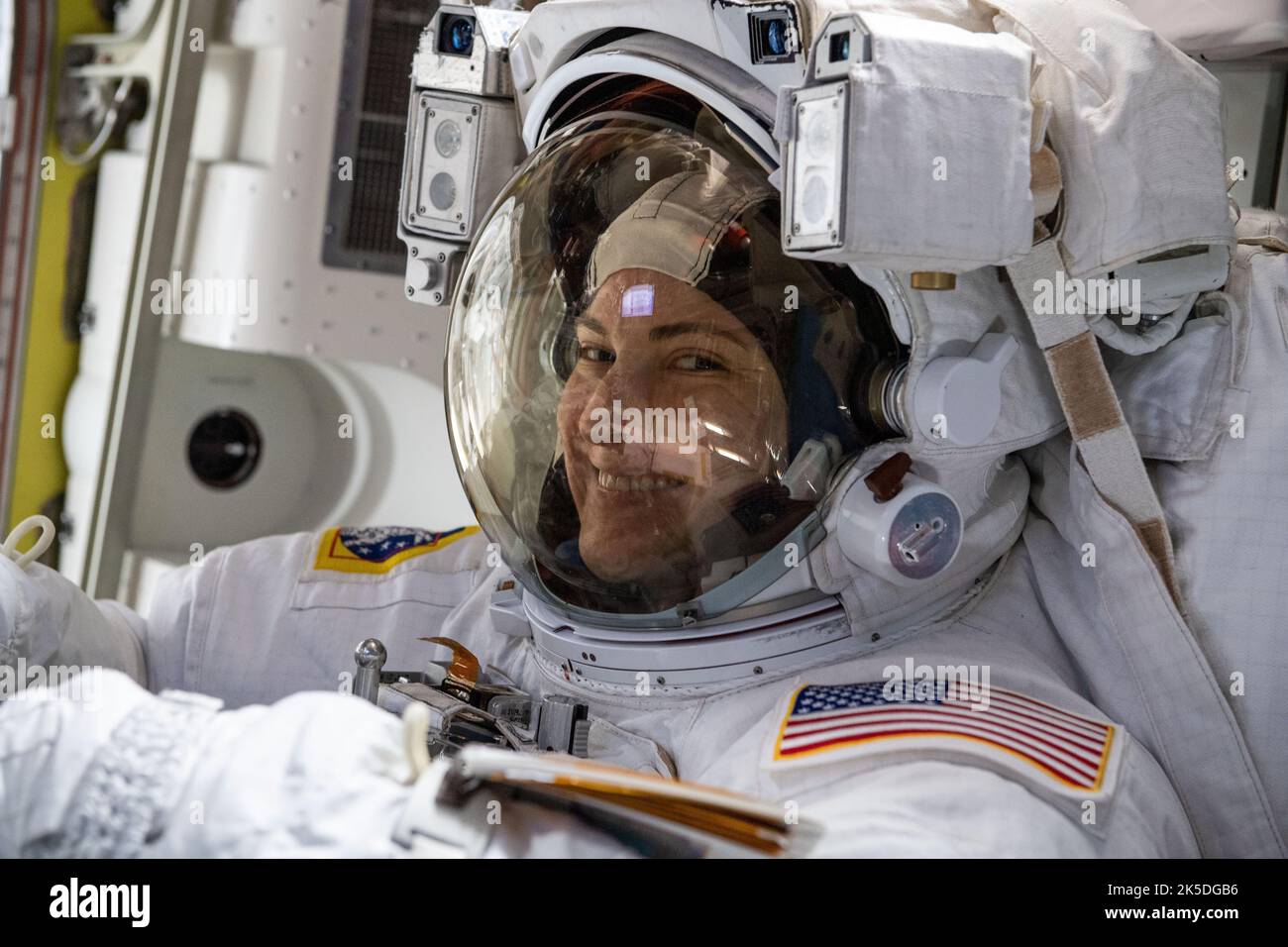 NASA astronaut Kayla Barron is pictured inside the U.S. Quest airlock ...