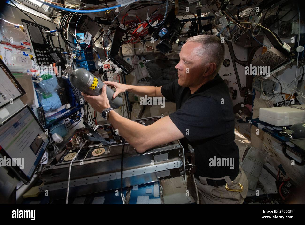 Astronaut Bob Hines, Expedition 67 Flight Engineer, replaces a carbon ...