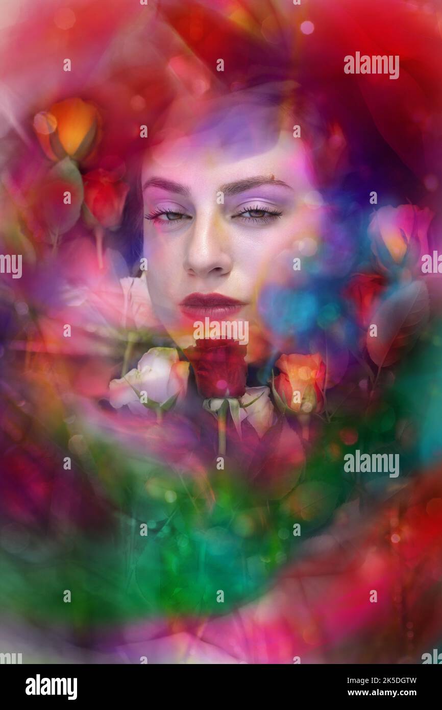 Roses in various colors are surrounding a dreamy womans face with ...
