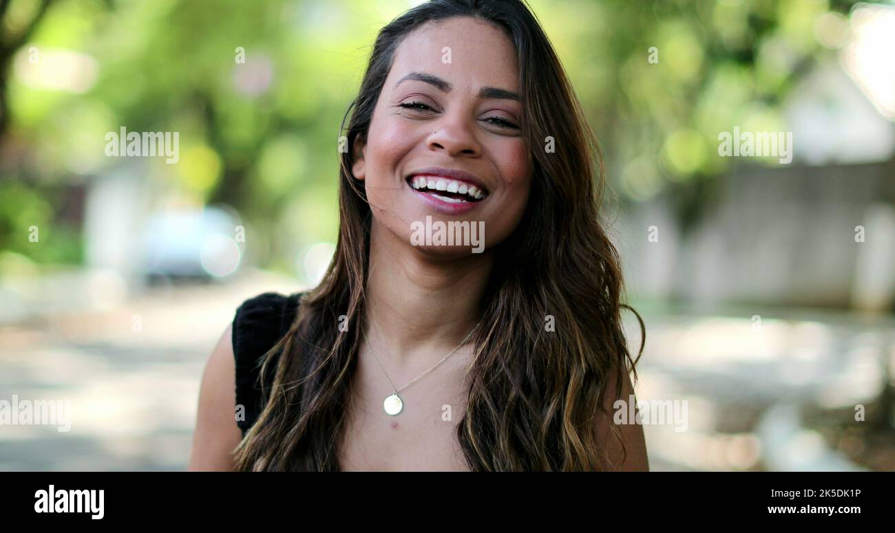 Pretty latin hispanic girl laughing and smiling. Young woman laughter ...