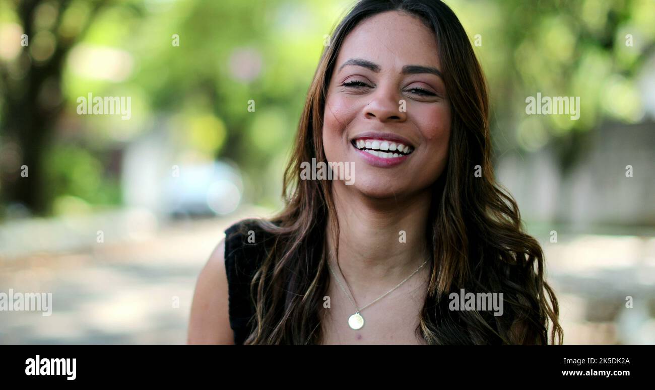 Pretty latin hispanic girl laughing and smiling. Young woman laughter ...