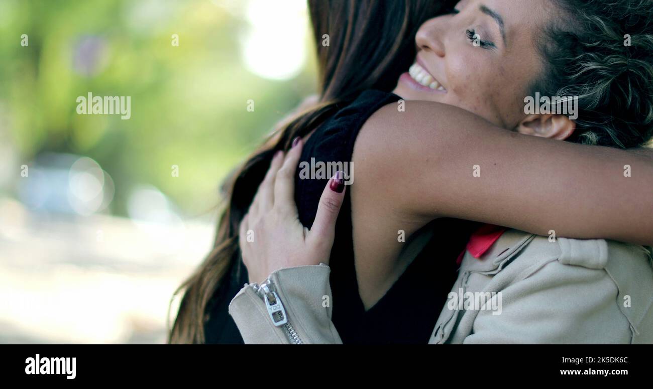 Two friends hugging and embrace in solidarity Stock Photo - Alamy