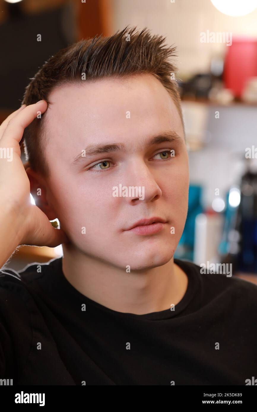 portrait of serious concentrated confident handsome young attractive ...