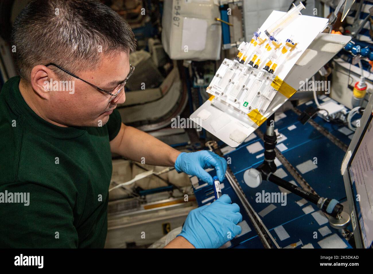 NASA astronaut Kjell Lindgren is see performing Forward Osmosis ...