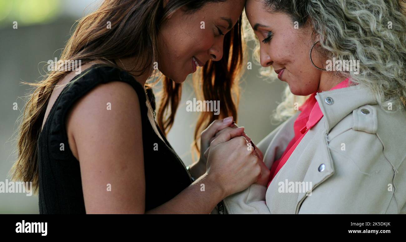 Two happy women holding hands and embrace, girlfriends hugging Stock ...
