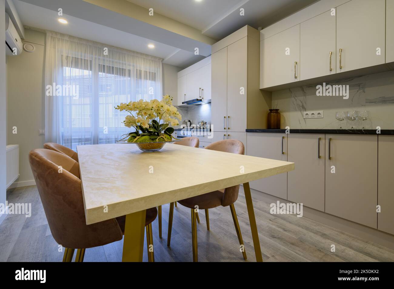 Large beige and cream luxury kitchen interior Stock Photo - Alamy