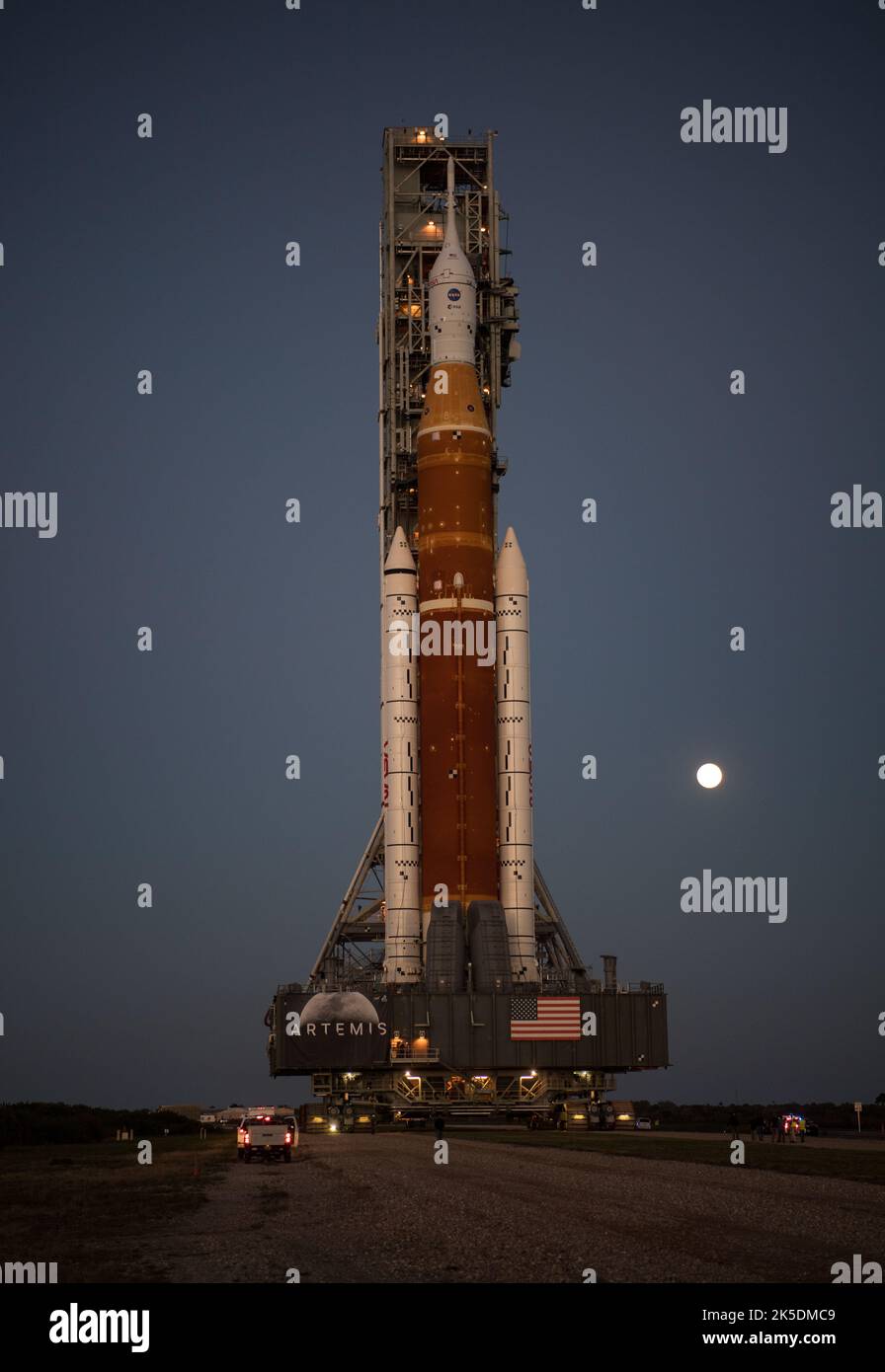 The Moon is seen rising behind NASA’s Space Launch System (SLS) rocket ...