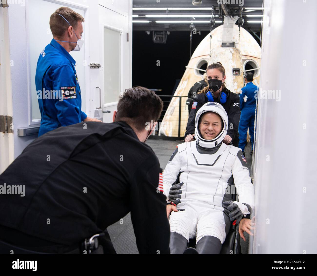 NASA astronaut Tom Marshburn greets friends after being helped out of ...