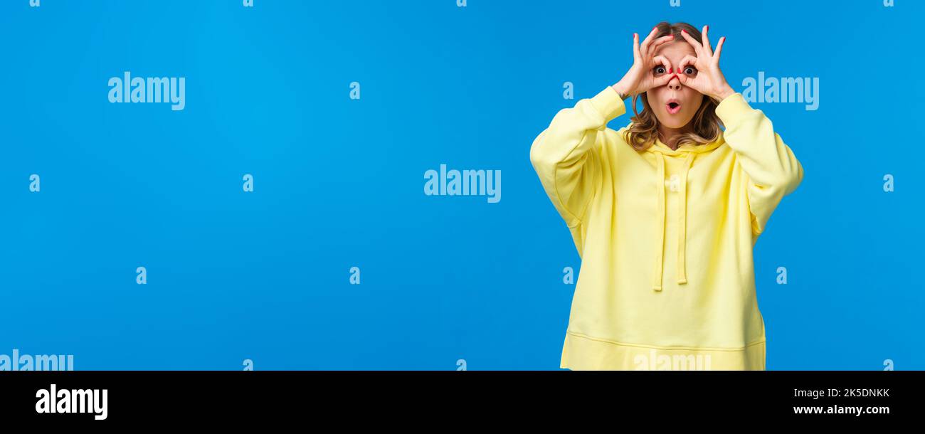 Wow interesting. Intrigued and surprised curious blond girl seeing ...