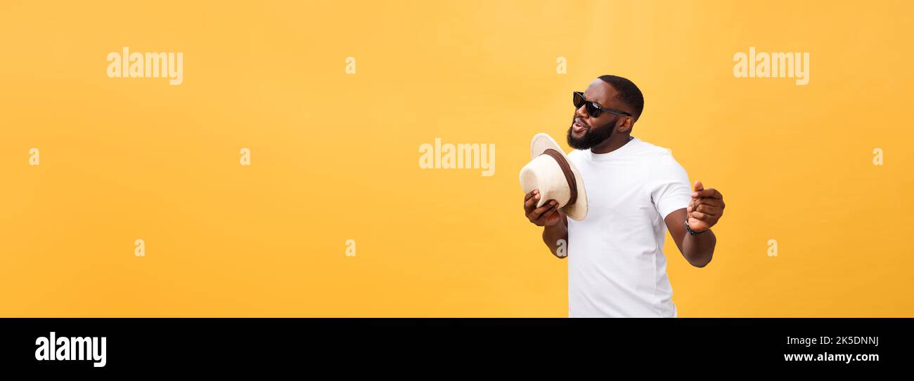 Young black man top dancing isolated on a yellow background Stock Photo ...
