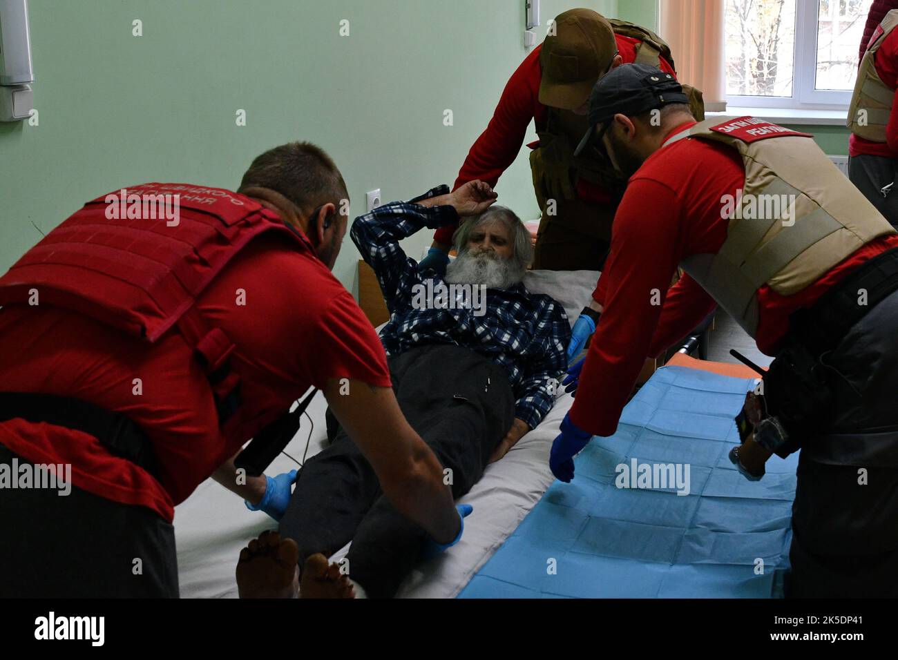 Valeriy Abakumov, 68 (center) is seen with the Red Cross Ukraine ...