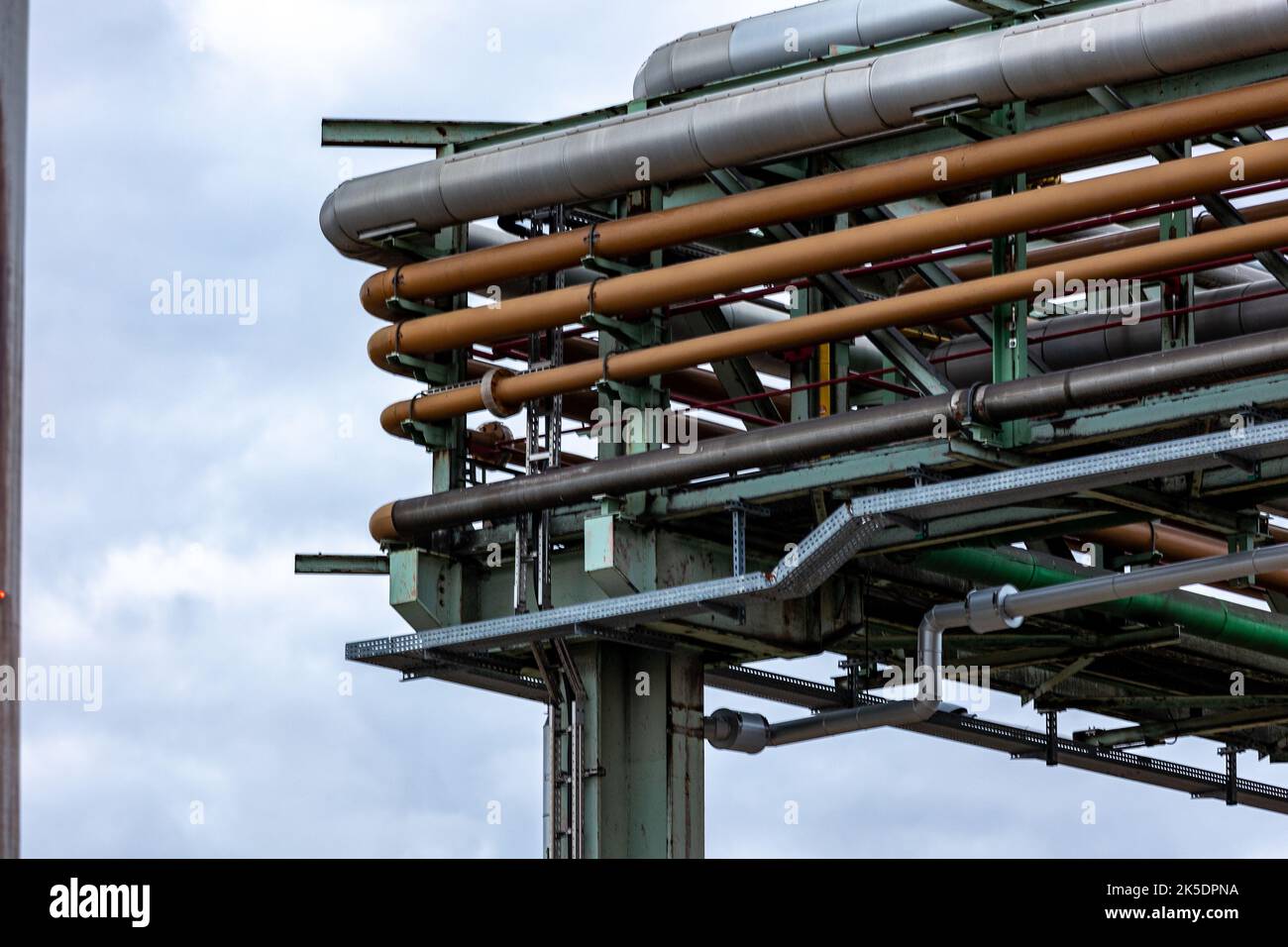 The pipelines of a German factory under the cloudy sky Stock Photo - Alamy