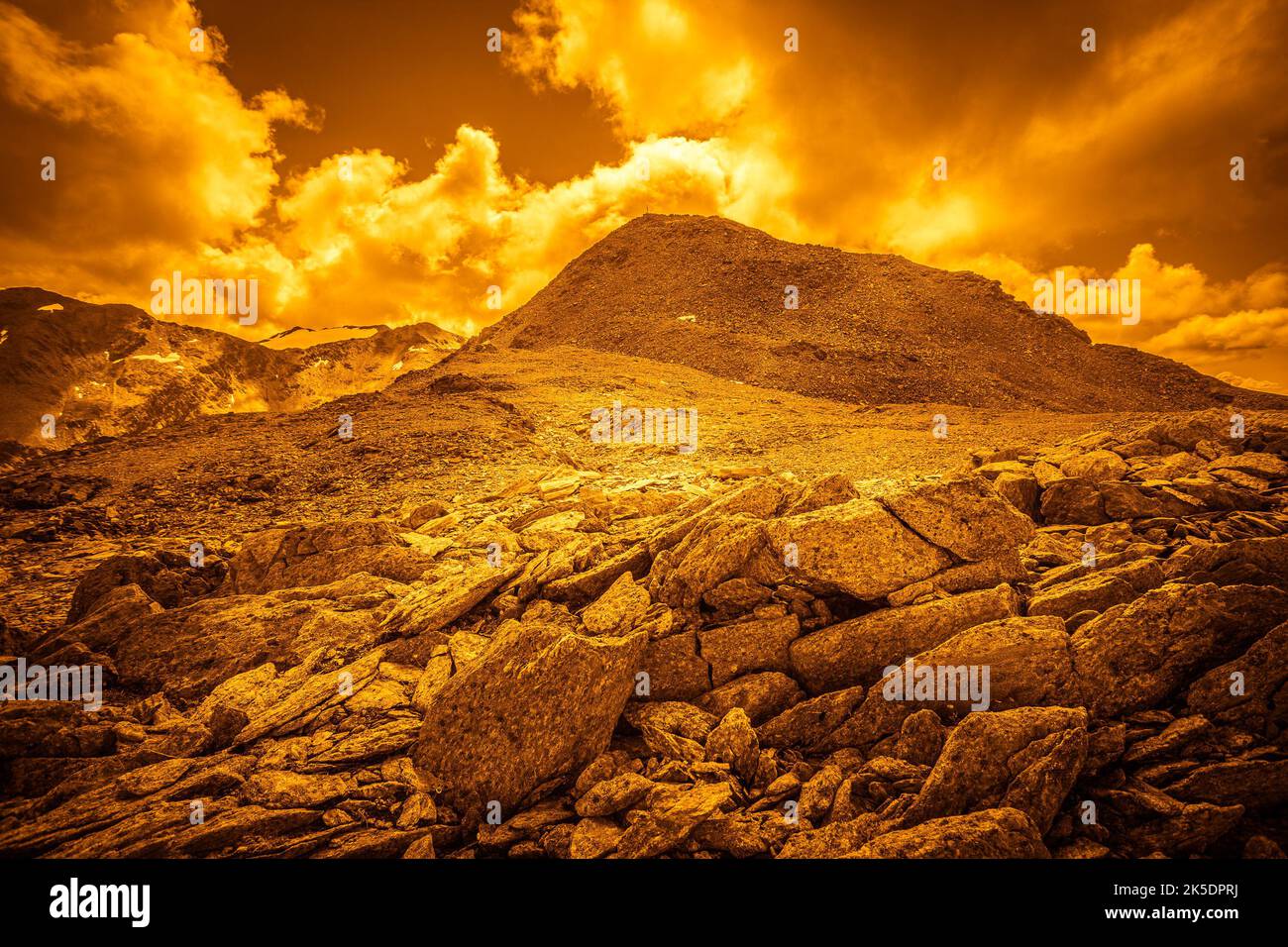 Fantasy orange effect color of alpine panorama with rocky peaks and ...