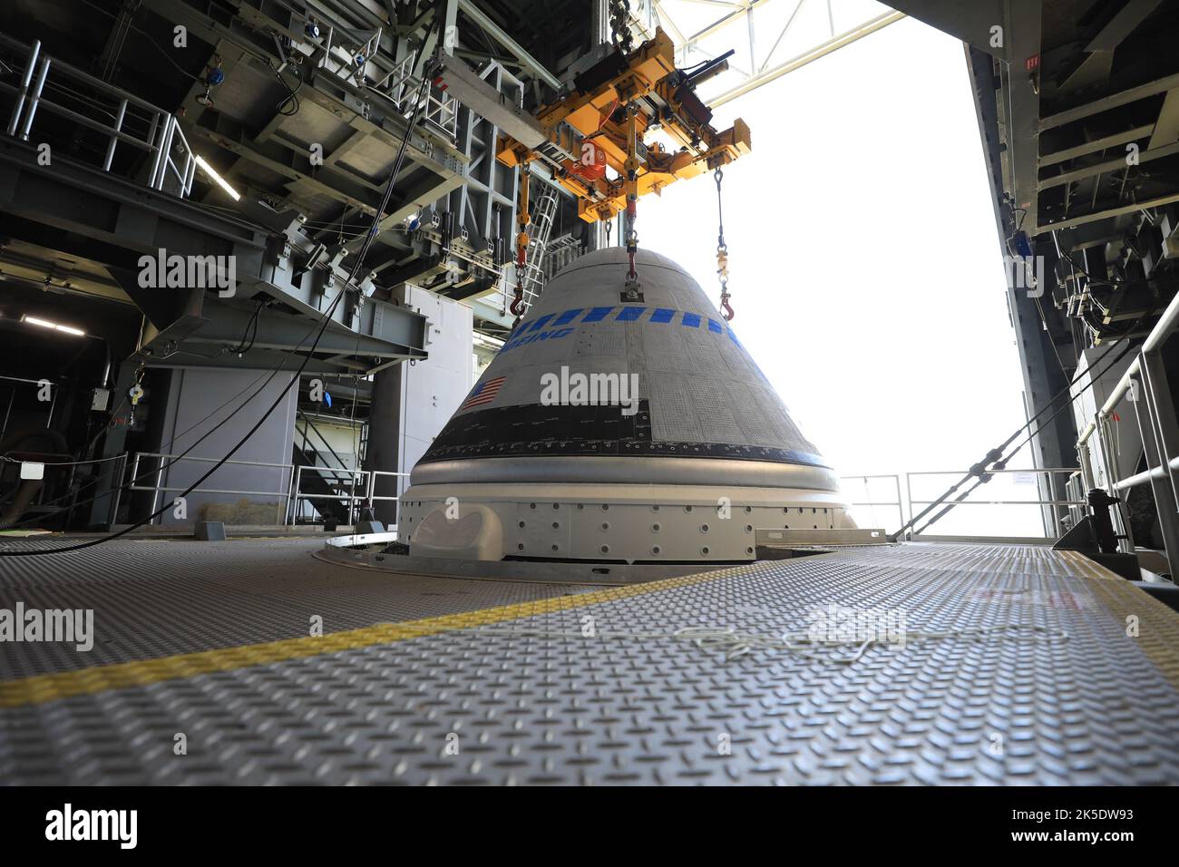 The Boeing CST-100 Starliner spacecraft is lifted at the Vertical ...