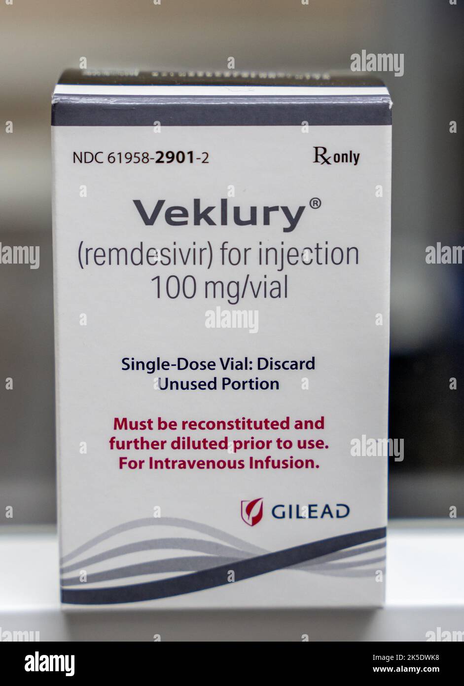 The vertical view of a box of remdesivir Injection 100mg over the white ...