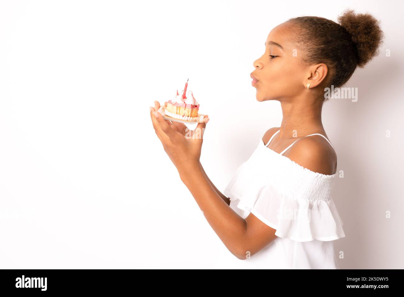 Cute adorable child african american girl celebrating birthday while ...