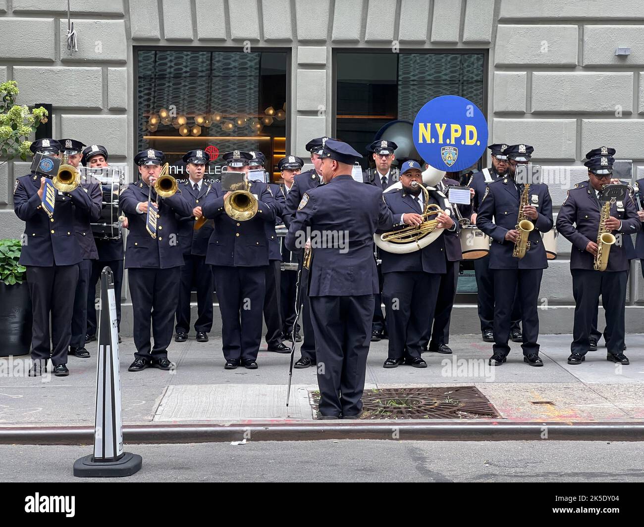 The highly skilled NYPD Marching Band warms up to march and play in the ...