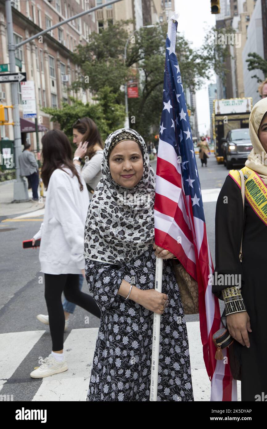 Muslim woman proudly carries an American Flag in the American Muslim ...