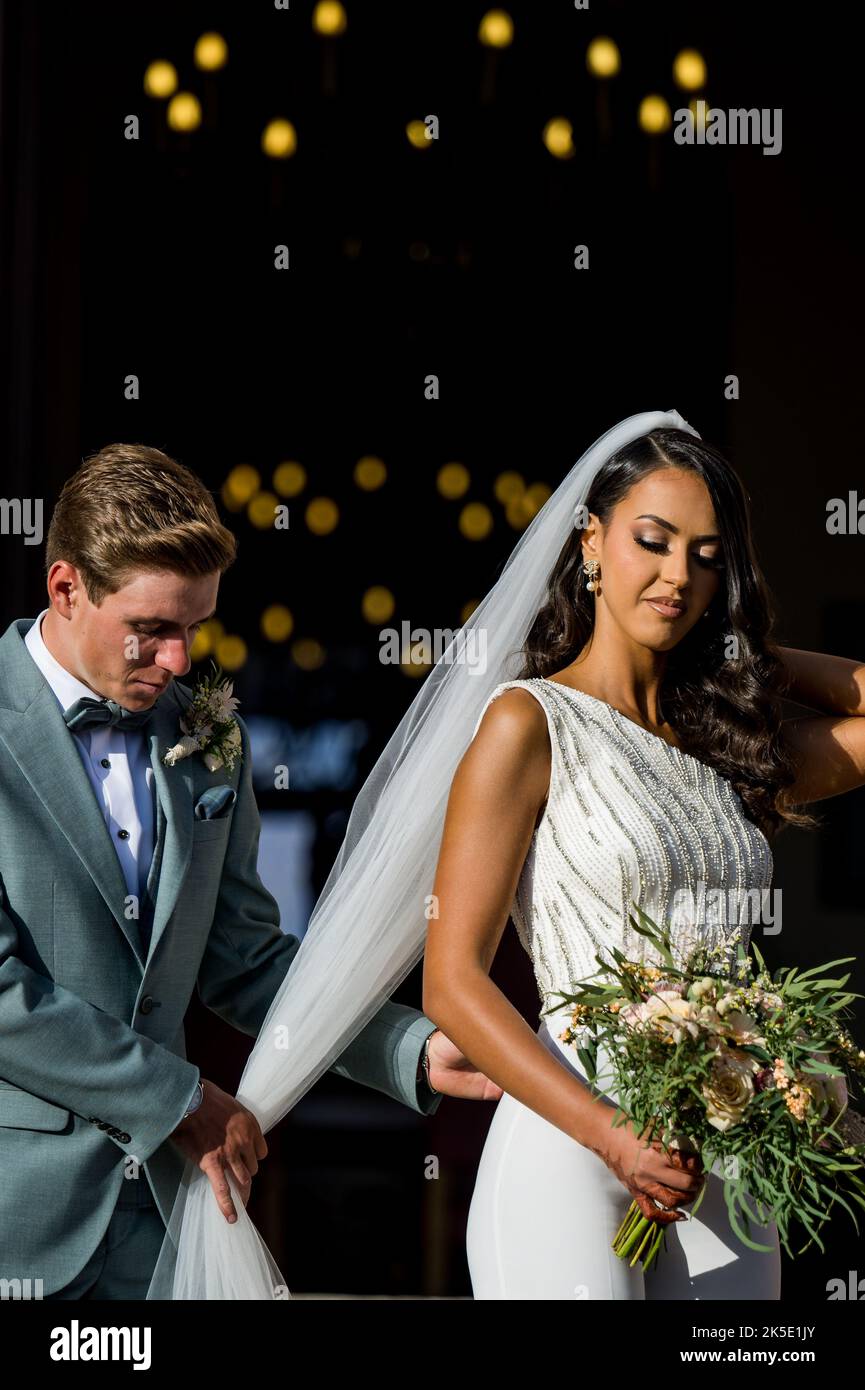 Remco Evenepoel helps his wife Oumaima Oumi Rayane with the long veil ...