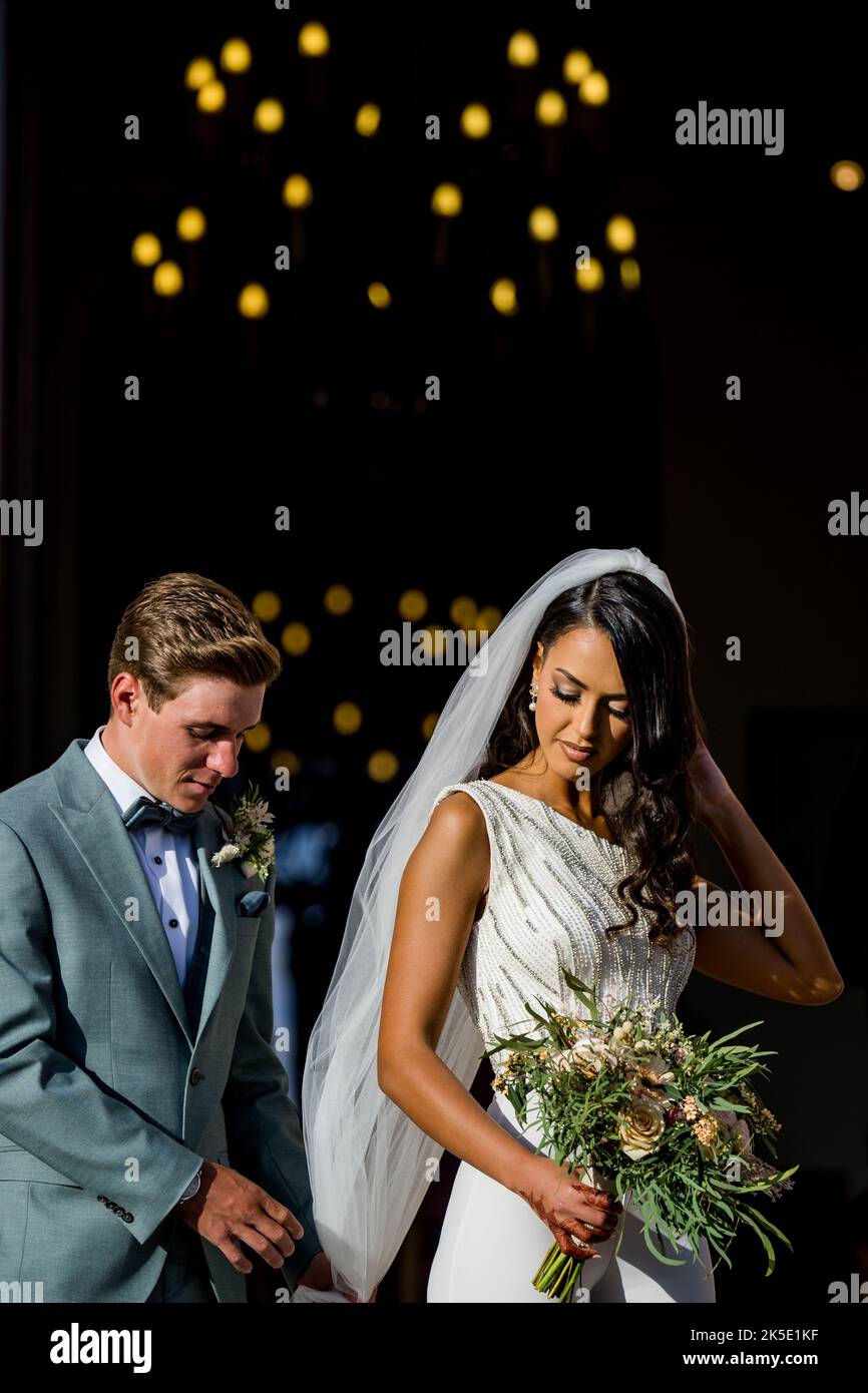 Remco Evenepoel helps his wife Oumaima Oumi Rayane with the long veil ...