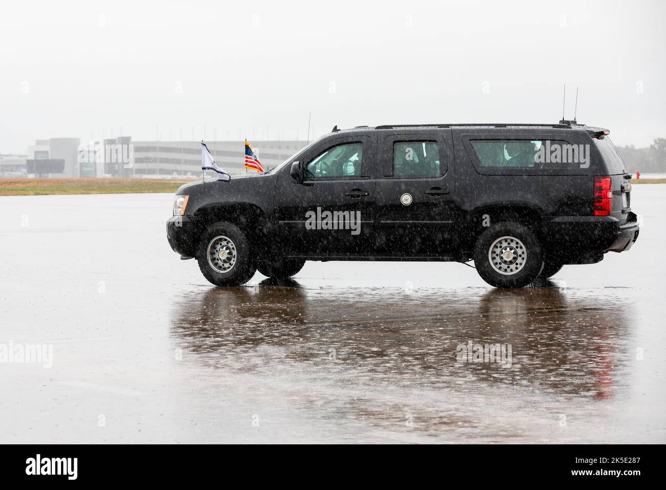 An SUV, part of Vice President Kamala Harris’ motorcade, drives across ...