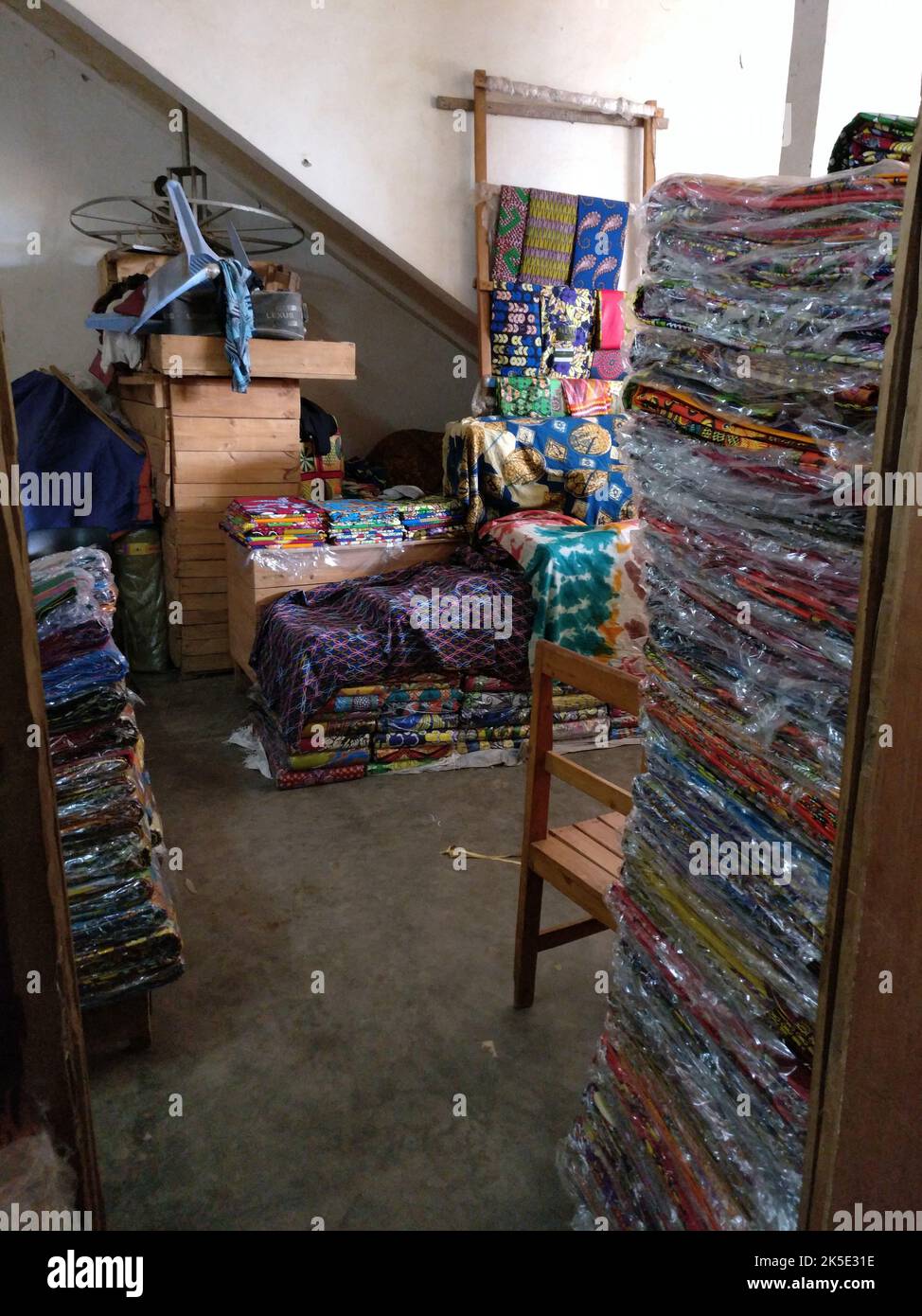A vertical shot of lots of different fabric in a store in Kigali ...