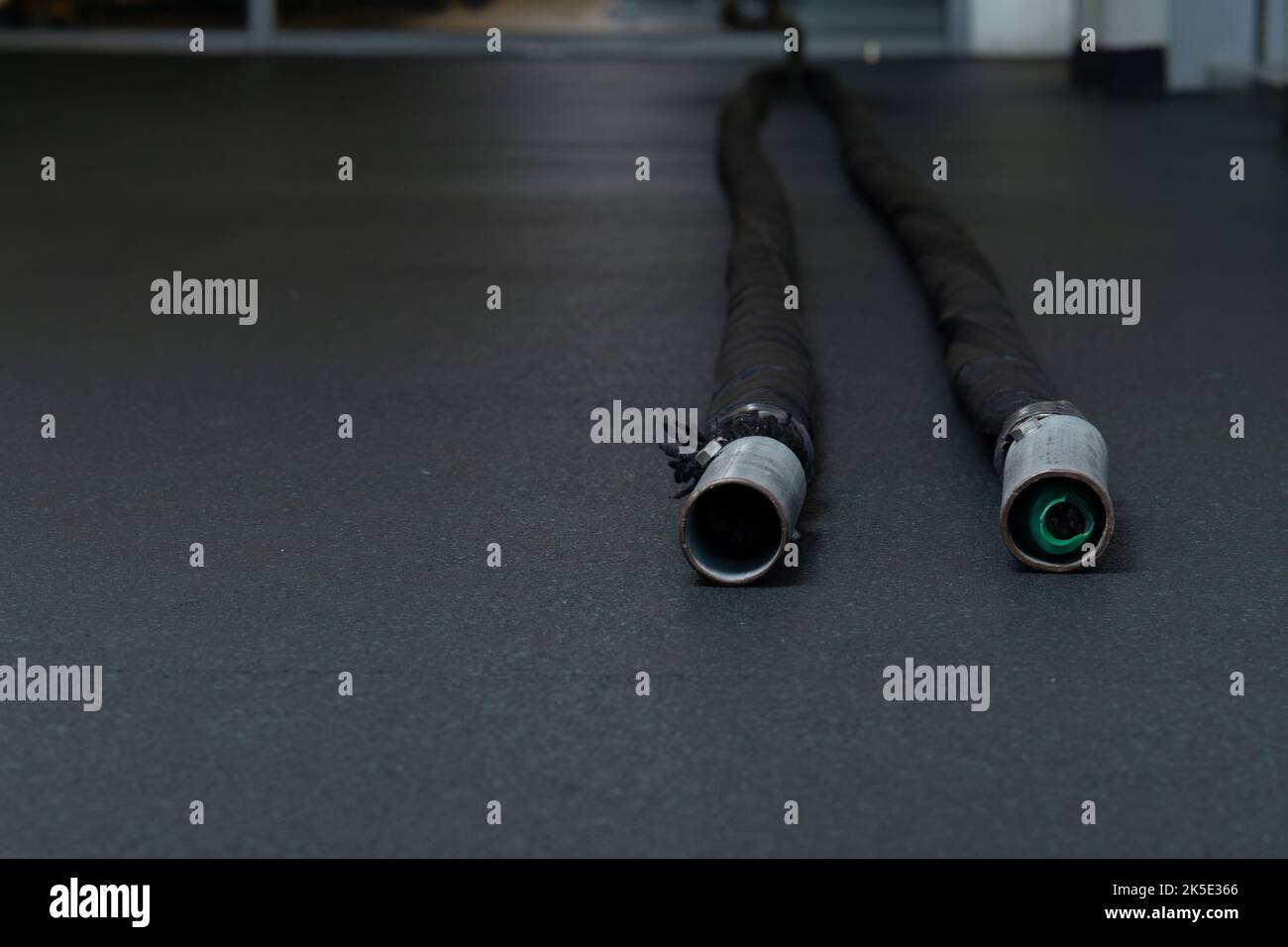 Gym fit battle training rope woman cross athlete muscular, from active ...