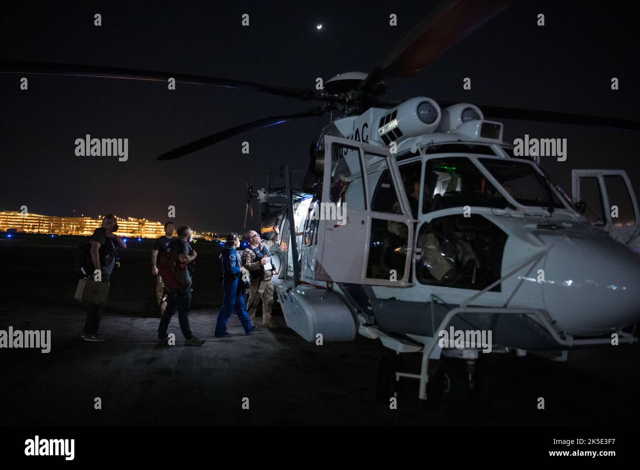 NASA and SpaceX support teams board a helicopter to reach the SpaceX ...
