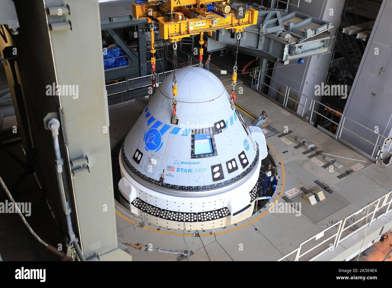 The Boeing CST-100 Starliner spacecraft is lifted at the Vertical ...