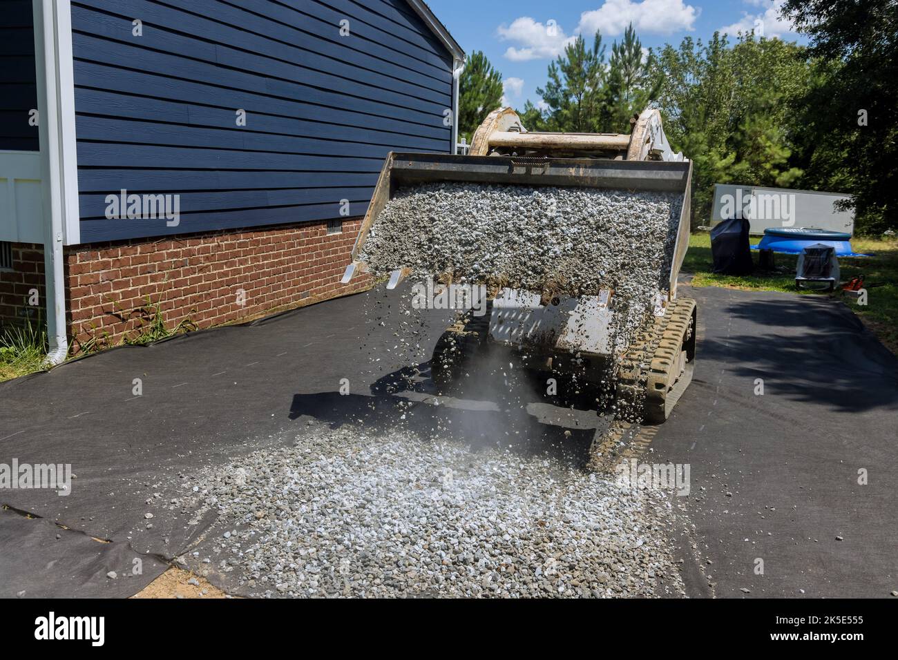 Using tractor, gravel preparation platform for installation storage ...