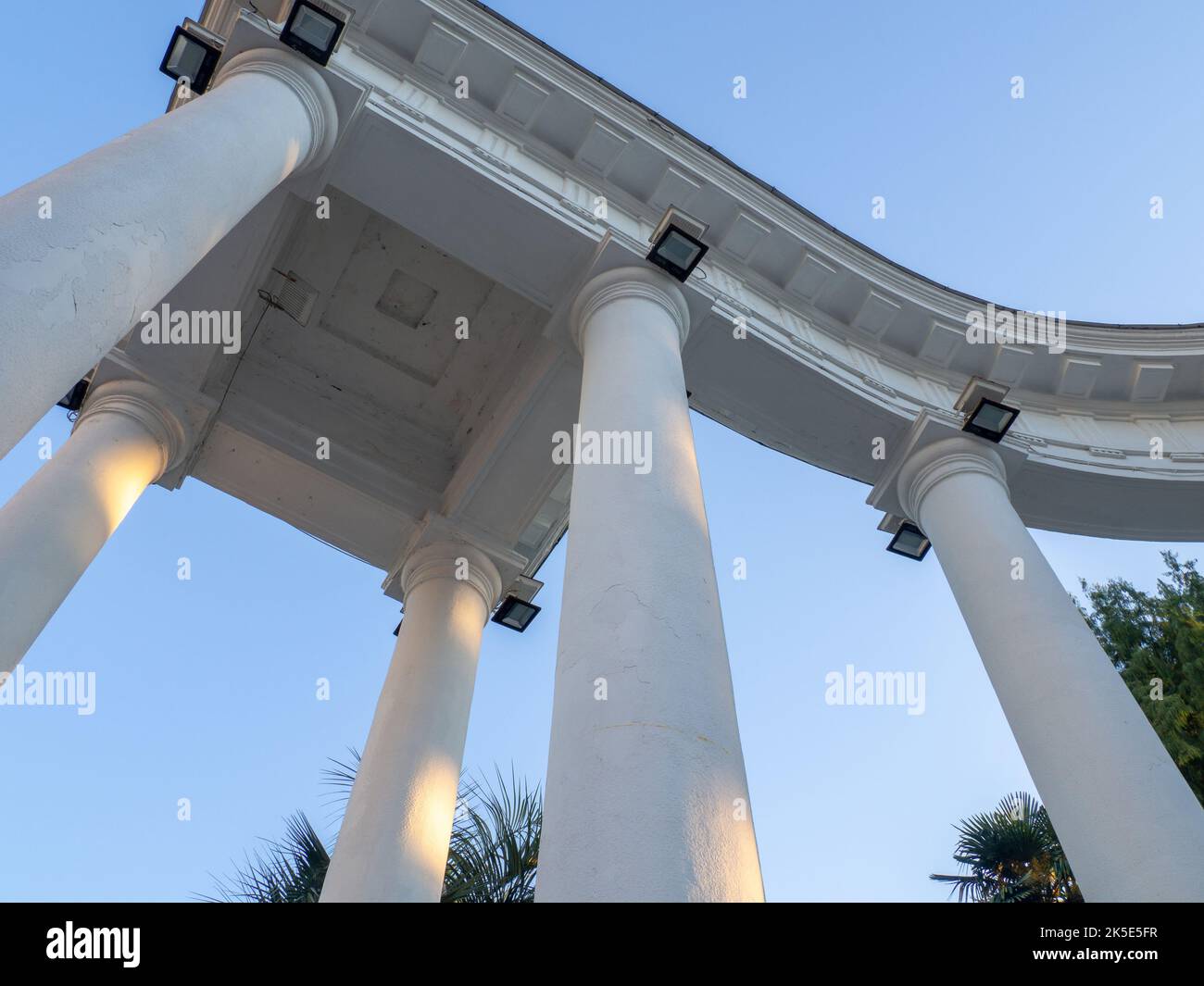 White arch and lanterns on it. Architectural ensemble. Decorative ...