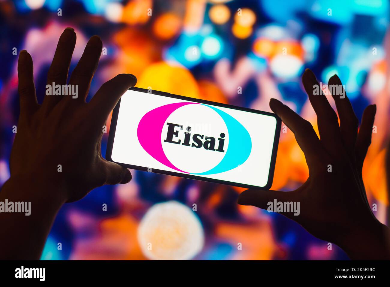 In this photo illustration, the Eisai Co., Ltd. logo is displayed on a ...