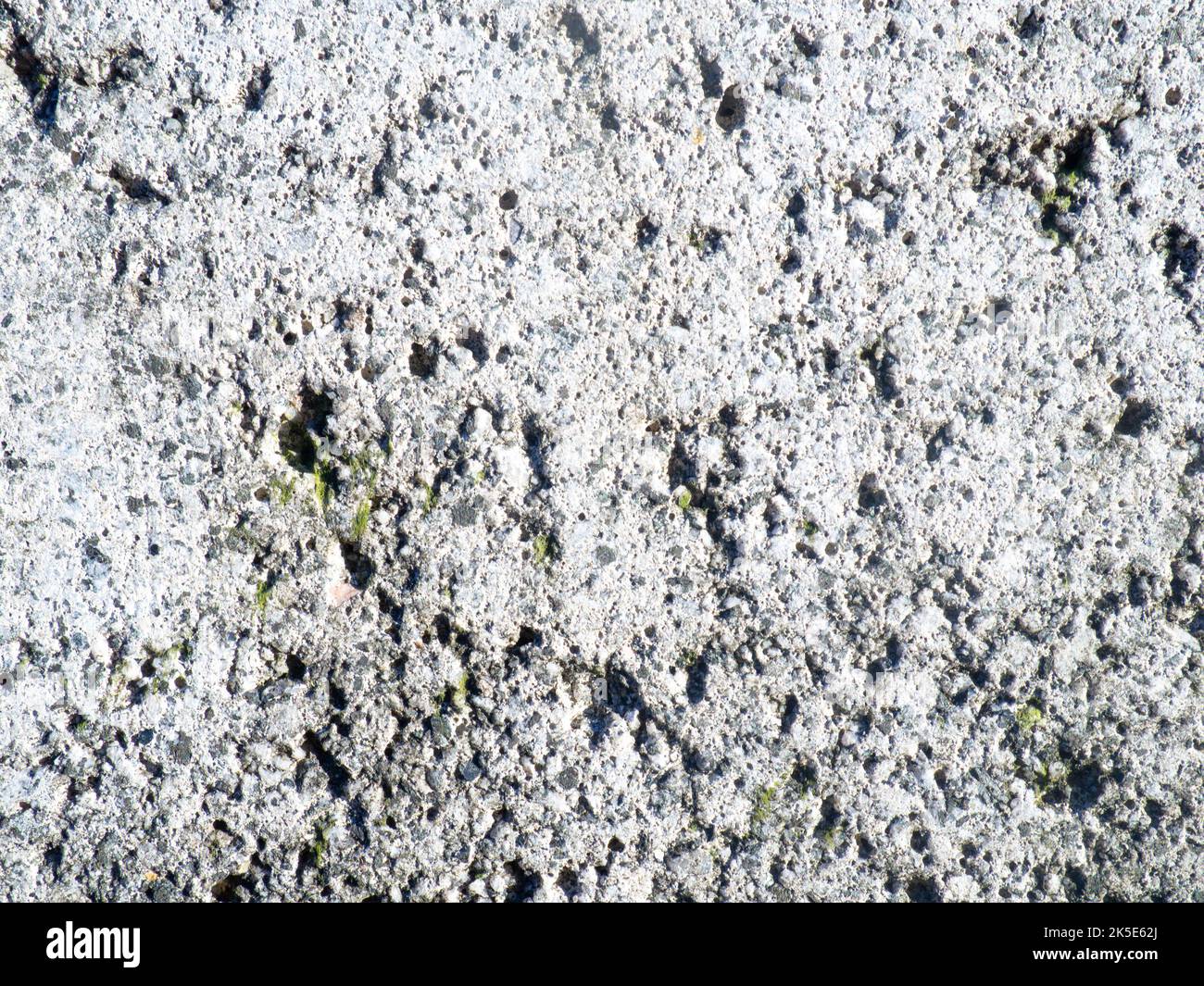 Background of porous concrete. Numbers on concrete. Gray wall. Solid ...