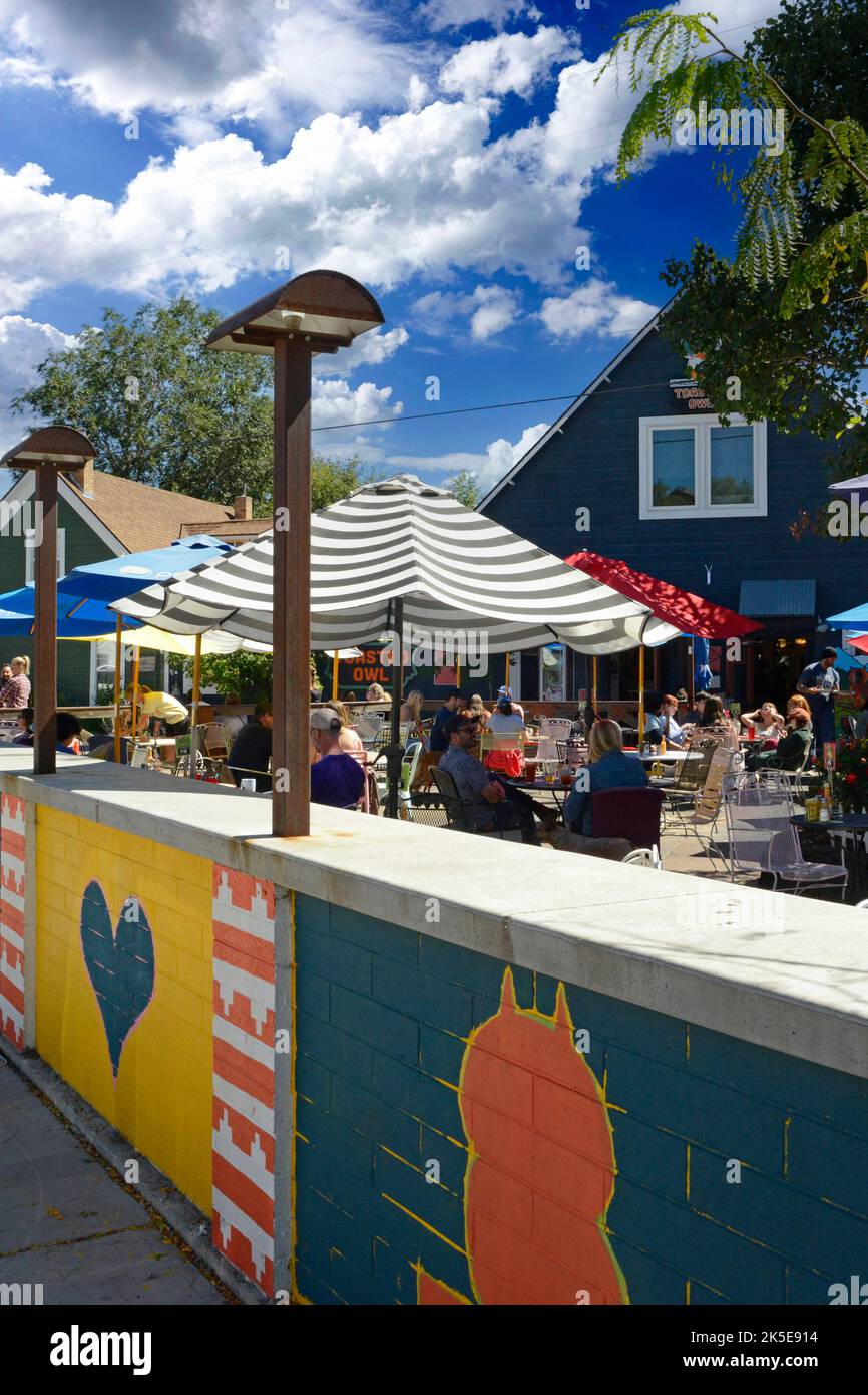 People outside enjoying the food and atmosphere at The Toasted Owl Cafe ...