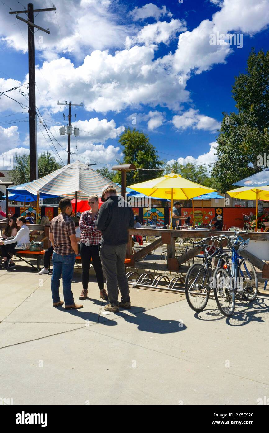 People outside enjoying the food and atmosphere at The Toasted Owl Cafe ...