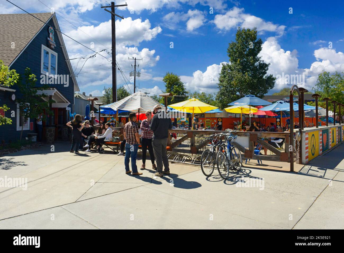 People outside enjoying the food and atmosphere at The Toasted Owl Cafe ...